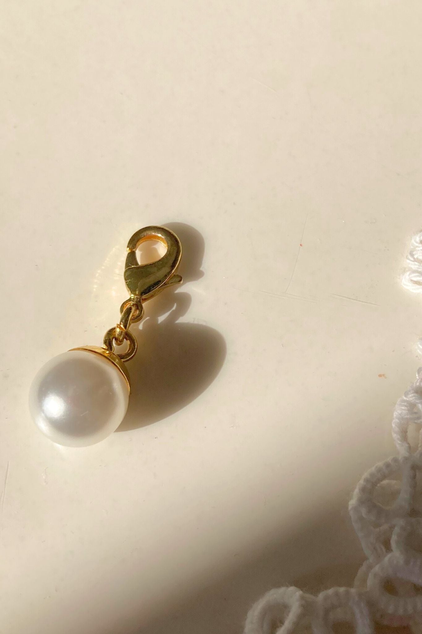 The Elsewhere Co | Gold Pearl Drop Bag Charm – The Elsewhere Co.